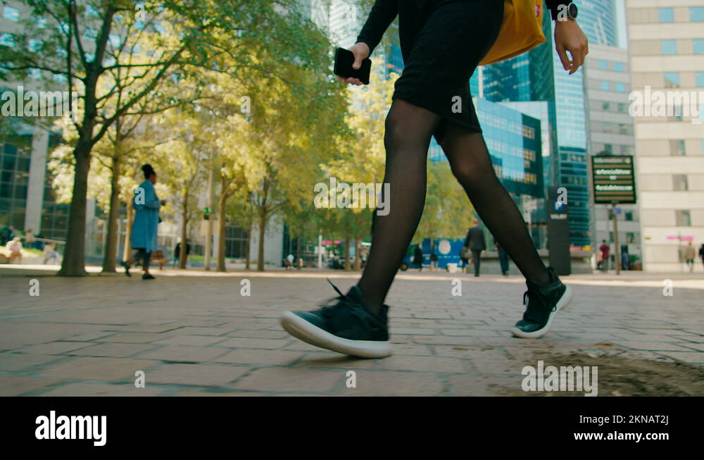 Unrecognizable Female Legs and Feet Walking in Downtown with Office ...