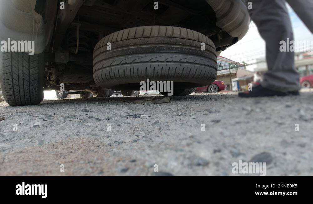 Removing the spare wheel from the car Stock Video Footage - Alamy