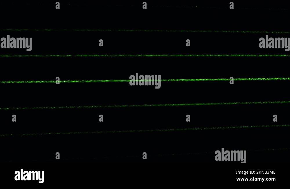 Dust particles in green laser light beam from diffraction grating Stock ...