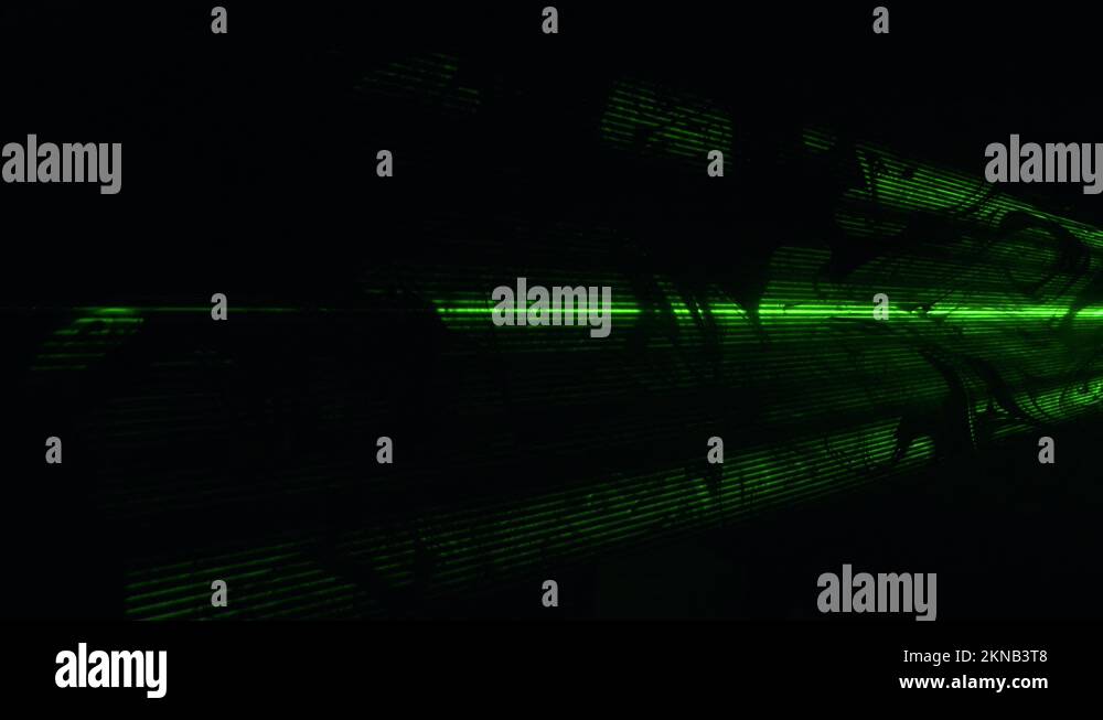 Dust particles in green laser light beam from diffraction grating Stock ...