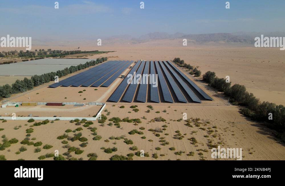 4K Birds Eye View of Solar Panels Farm or solar cell with sunlight ...