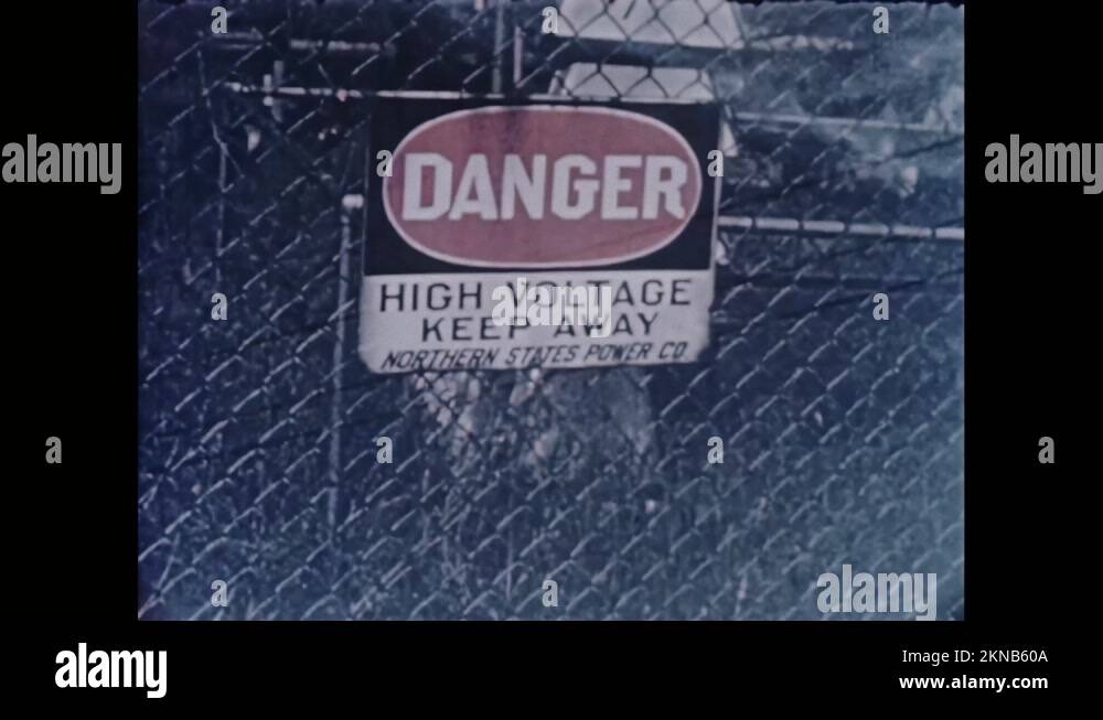1950s: Power lines. Danger - High Voltage fence and sign. Power ...