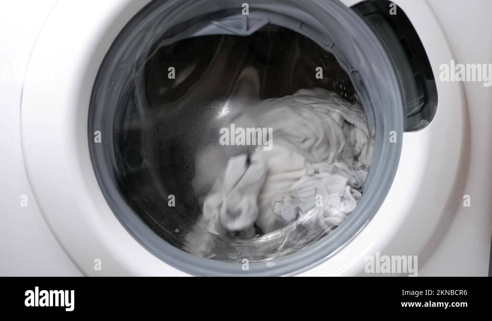 Washing clothes in a washing machine. 4k Stock Video Footage - Alamy