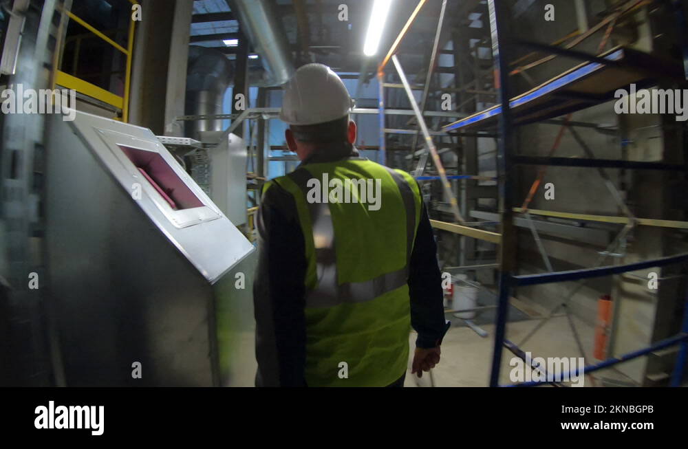 A worker walks through the factory. The production process at the ...