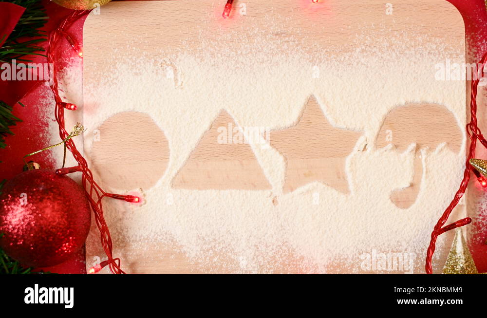 Cutting board with poured powder sugar and shapes of squid game dalgona ...