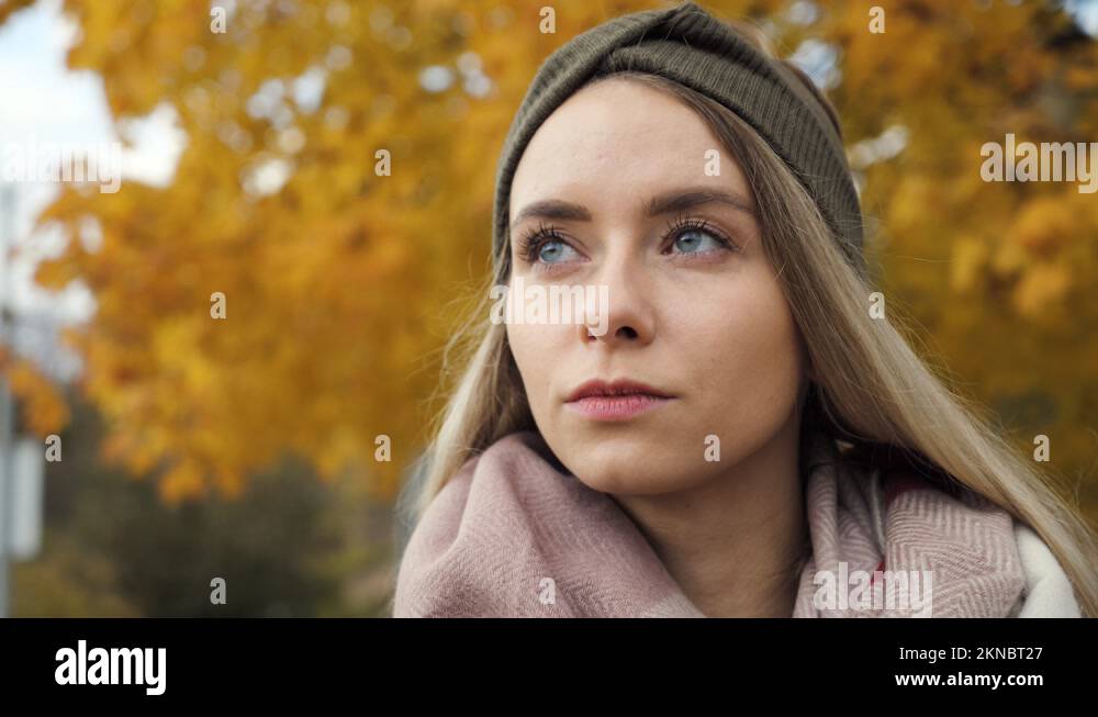 Pretty girl looking away with lively emotion while enjoying sunny ...