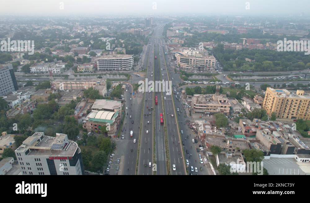 Traffic Commuting On Busy Highway Roads, Lahore Urban Cityscape Stock ...