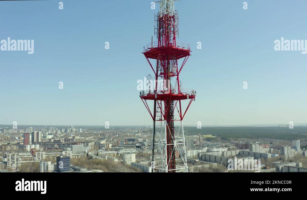 fly-around around a large area of a large telecommunications tower with ...