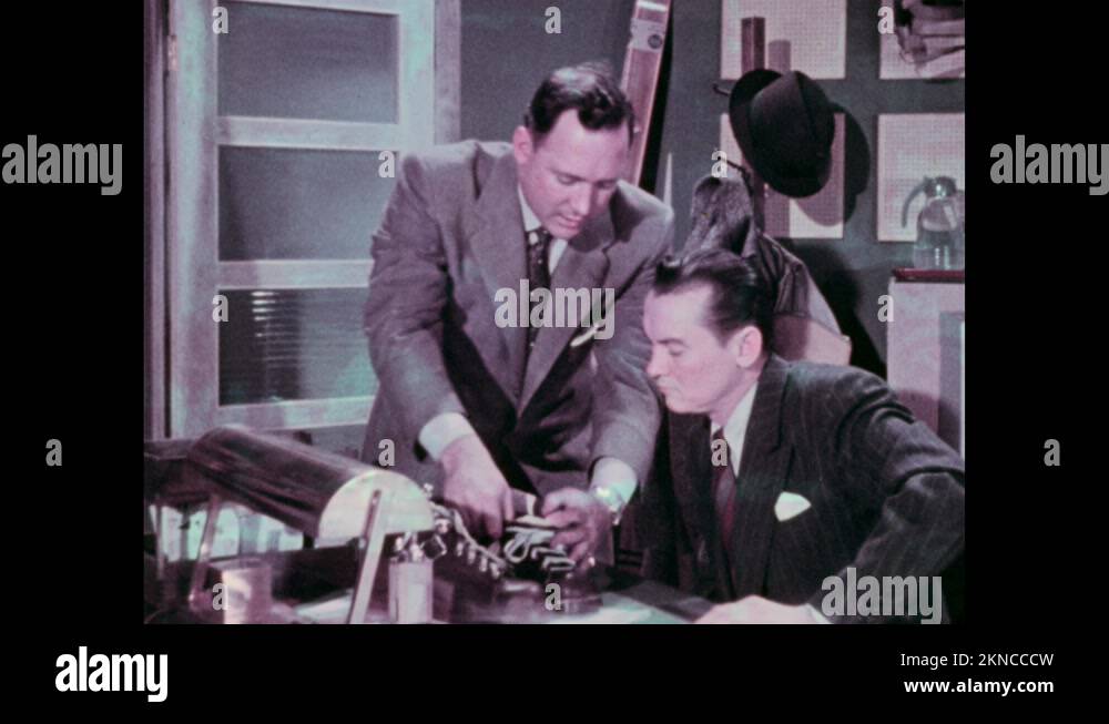 1950s: Man pointing out features of boots to another man Stock Video ...