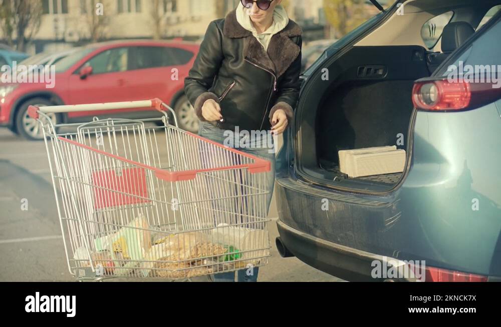 Female shopper by car Stock Videos & Footage - HD and 4K Video Clips ...