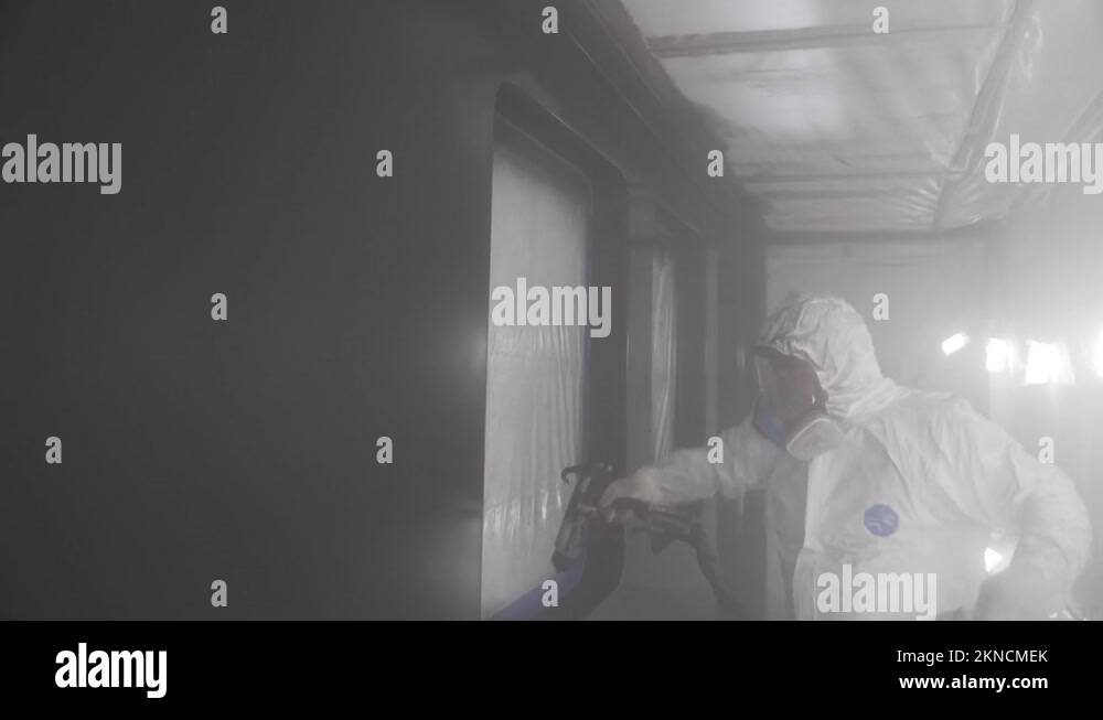 The shipyard masters paint the ship perfectly with the spray paint gun ...