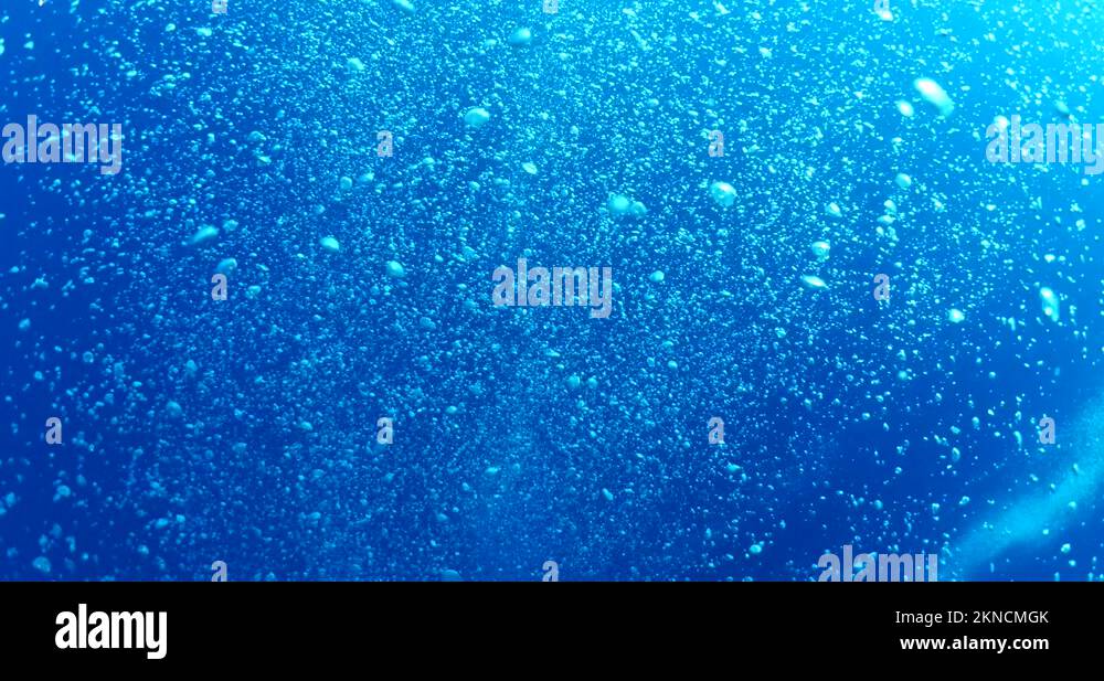air bubbles slow underwater dark blue ocean scenery from scuba divers ...
