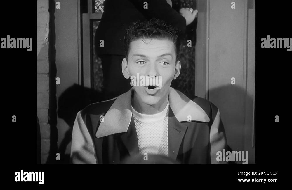 1940s: Frank Sinatra talks to group of boys in alley behind building ...