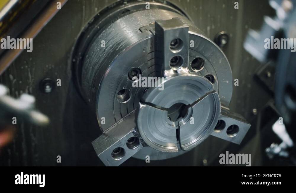 Changing parts and cleaning the lathe chuck of a CNC turning machine ...