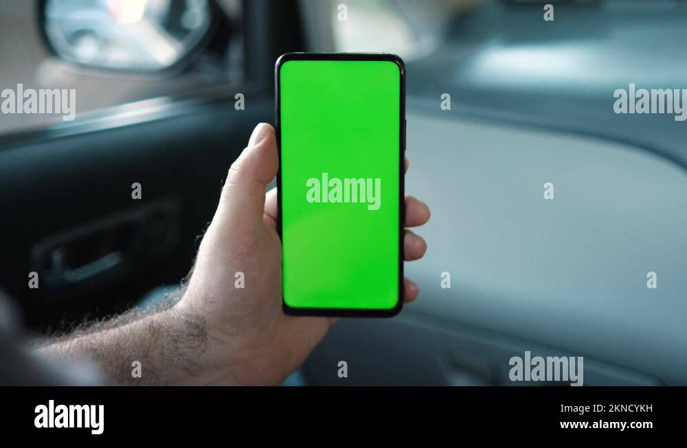 Handheld Camera: Back View of Man in car Holding Chroma Key Green ...