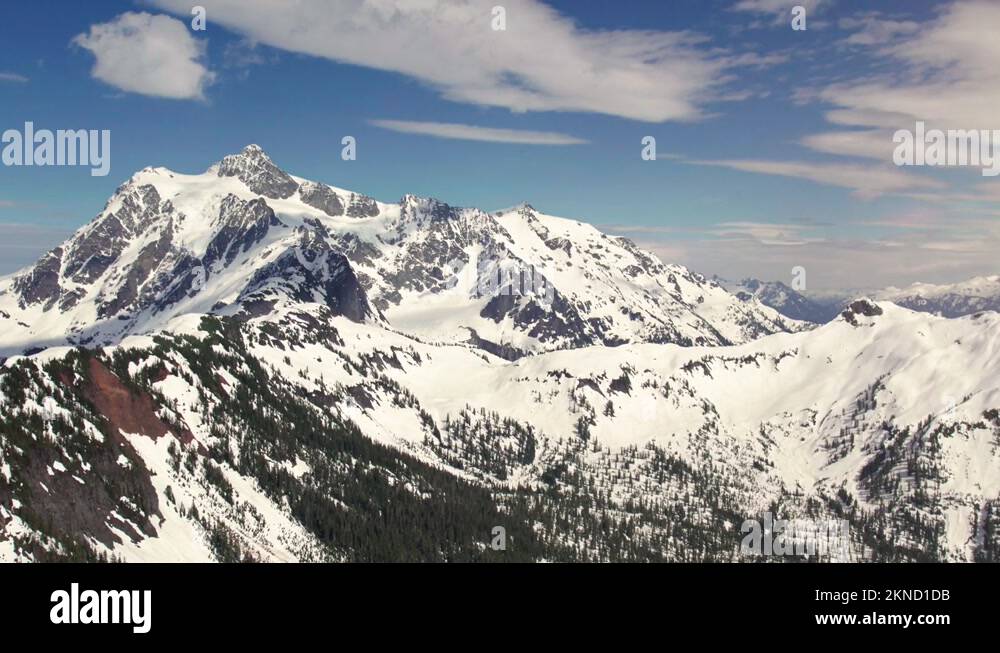Aerial Pan of Cascade Mountain Range and Mt Shuksan with Spring Snow ...