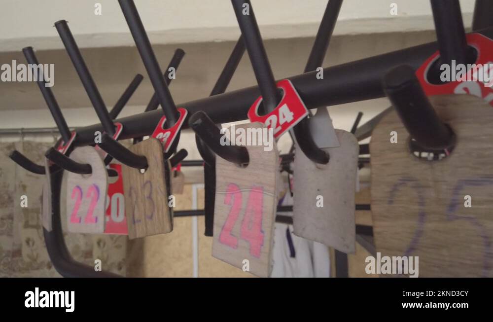Numbers on hangers in an empty dressing room or wardrobe Stock Video ...