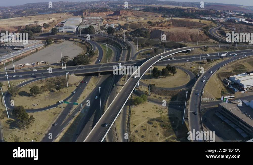 Drone footage of ring road with cars driving Stock Video Footage - Alamy