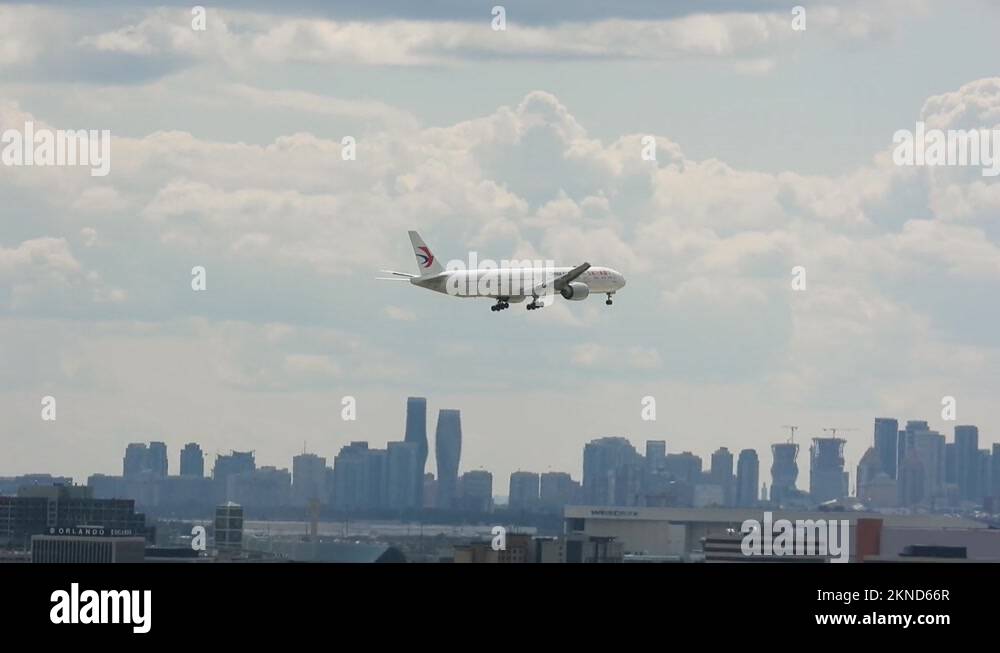 Aircraft Flying Over Toronto City skyline On Final Approach To Pearson ...