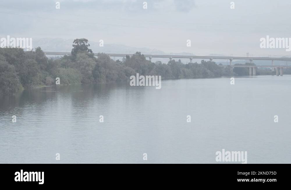 River landscape with mountains and highway bridge 4K Stock Video ...
