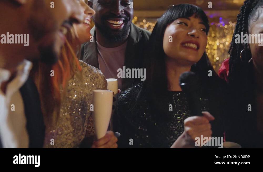 Tracking Shot Approaching Group of Friends Singing In Karaoke Bar Stock ...