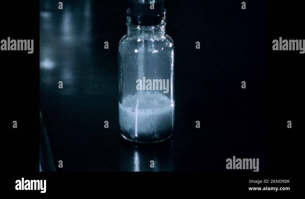1950s: Small jar with a bubbling, steaming chemical reaction. Small tub ...