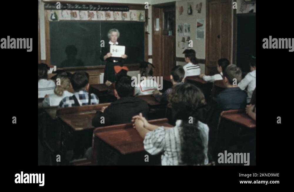 1950s: teacher at front of classroom using flashcards to quiz students ...