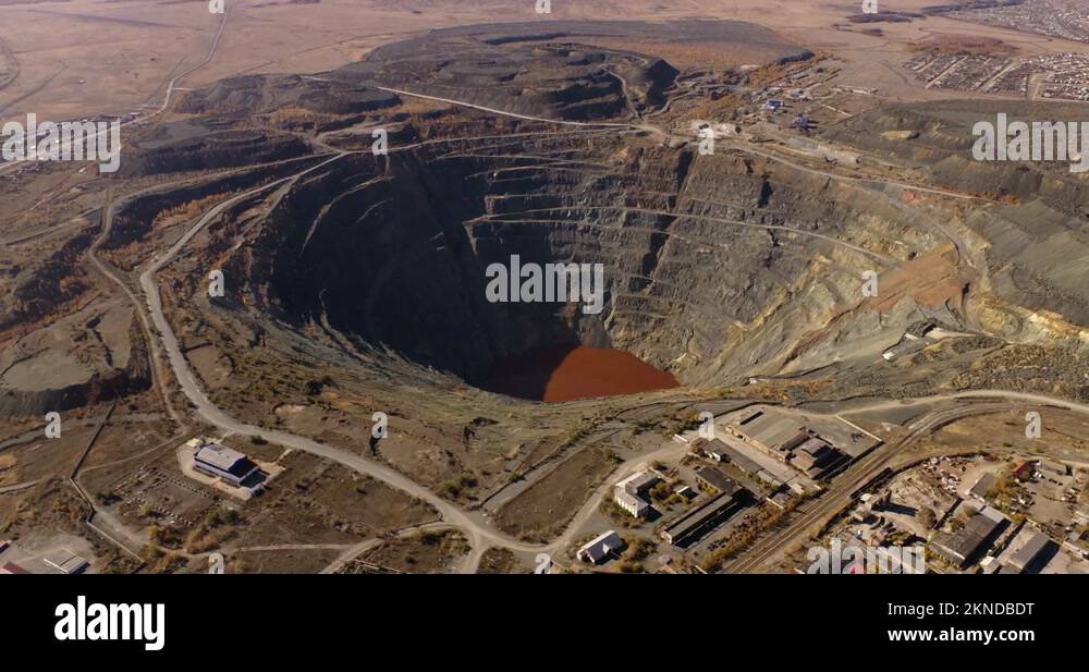 Industrial of mining quarry with flooded bottom. Extraction of iron ...