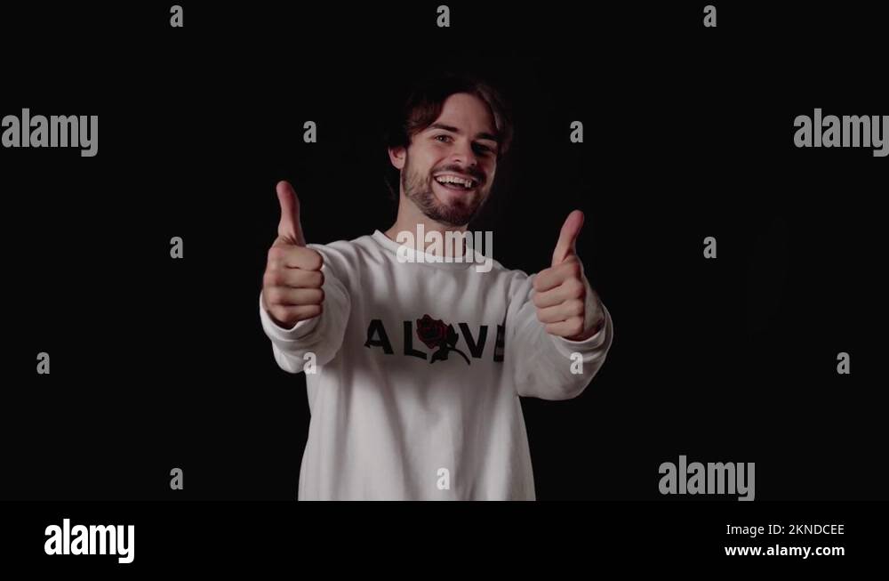 Trendy Young Man giving thumbs up, appreciative gesture, wide, black ...