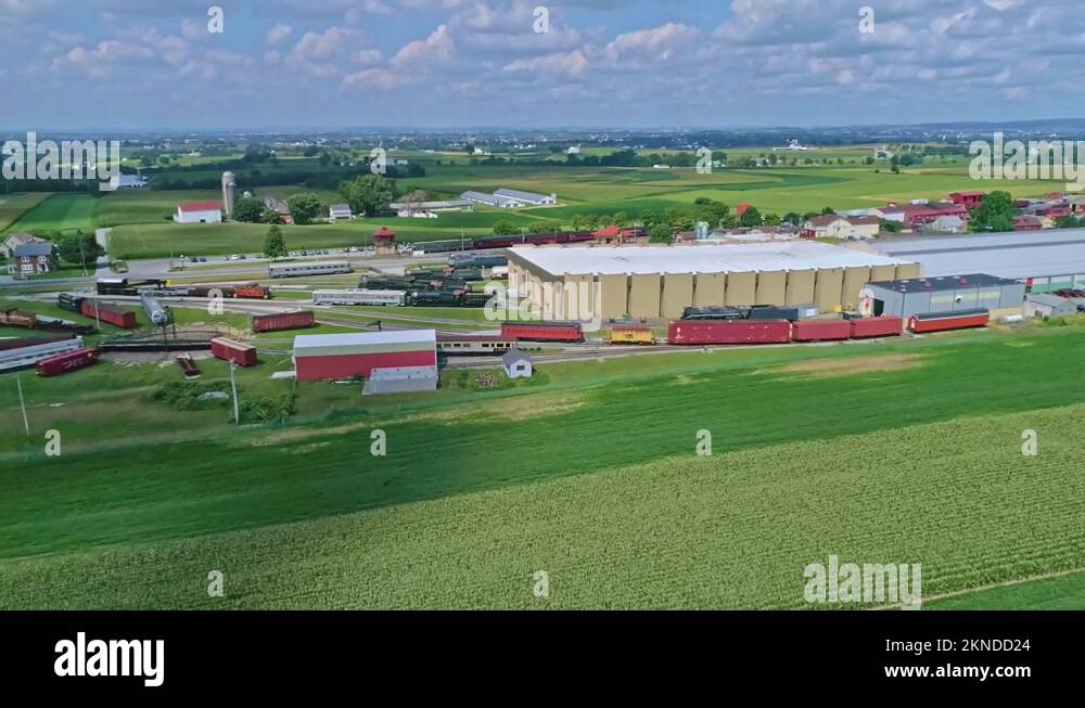 An Aerial Traveling View of Corn Fields and Harvesting Crops, With a ...