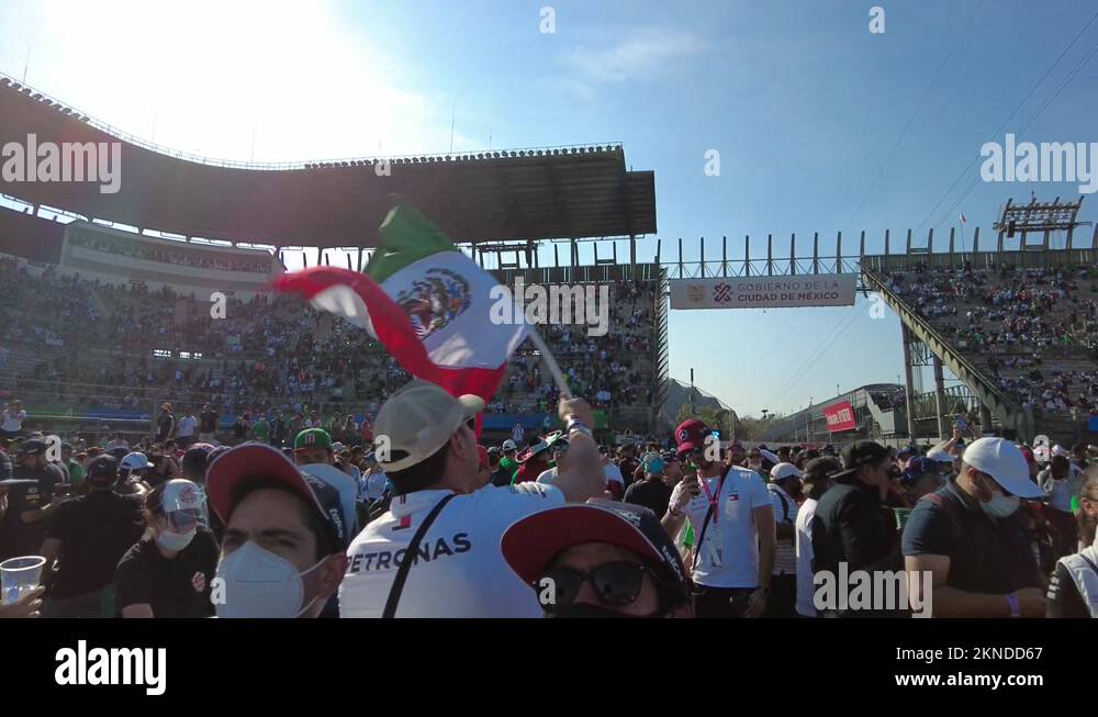 Mexican fan spectator celebrating cheering the podium of Sergio Checo ...