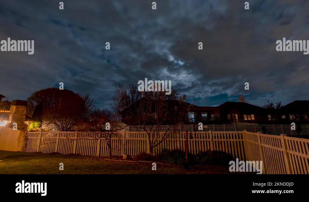 Watching the full moon rising over a typical suburban neighborhood on ...