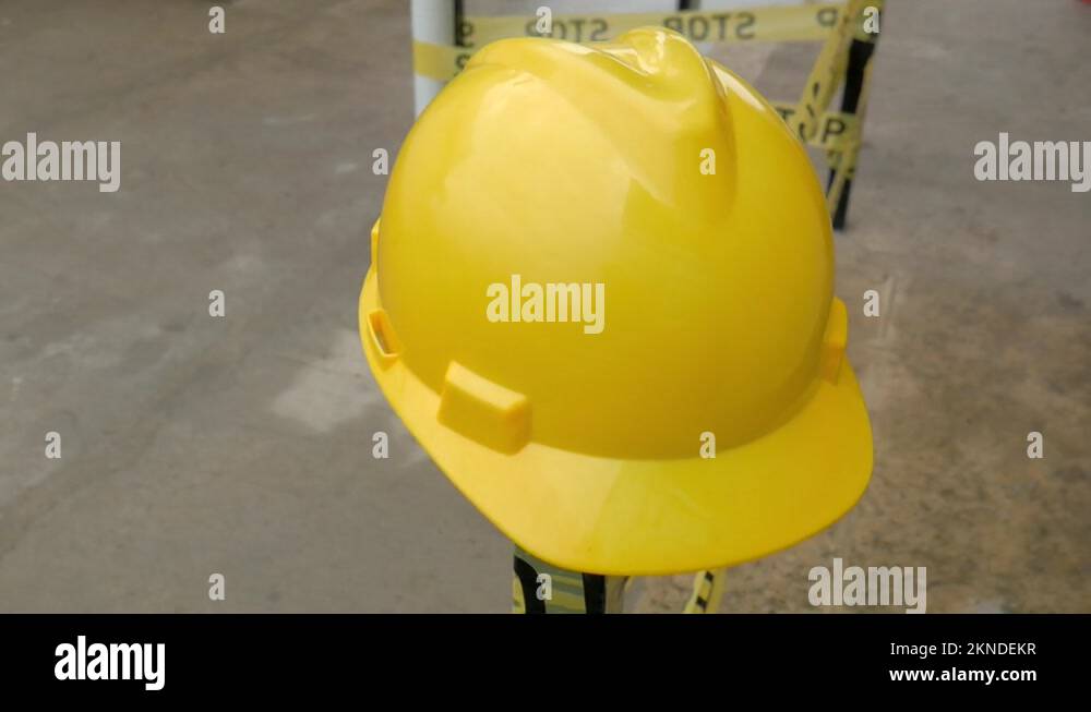 Yellow construction helmet at the construction. Personal protective ...
