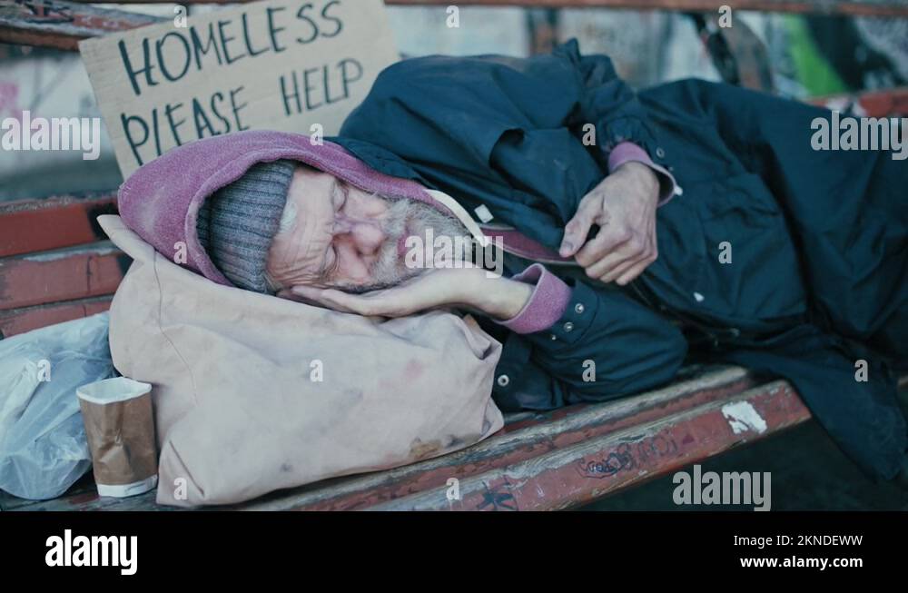 Homeless male with grey beard lying on the bench, socially vulnerable ...