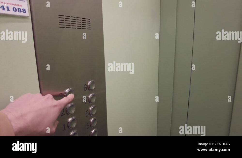 Pressing a button on a modern elevator panel Stock Video Footage - Alamy