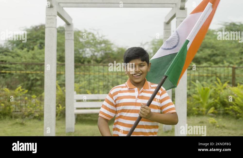 hindu boy running with indian flag concept Stock Video Footage - Alamy