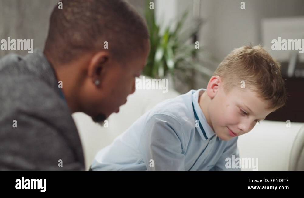 Black man tutor conducts private English lesson to schoolboy Stock ...