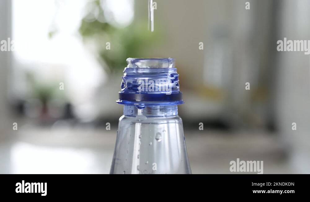 Filling a Plastic Bottle Drop by Drop with Water. Making Water Reserve ...