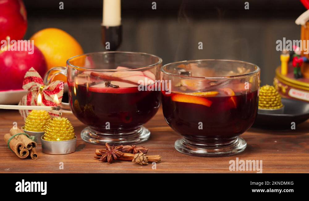 Mulled wine in glasses, gluhwein close-up. Hot red wine with apples ...