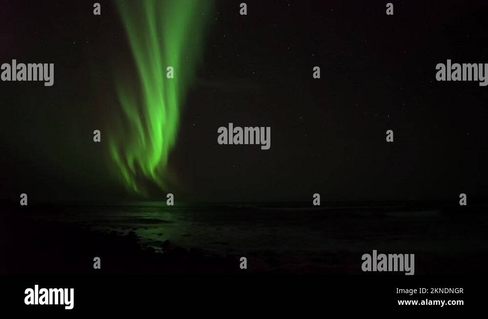 Aurora borealis over ocean open star filled sky real-time Stock Video ...