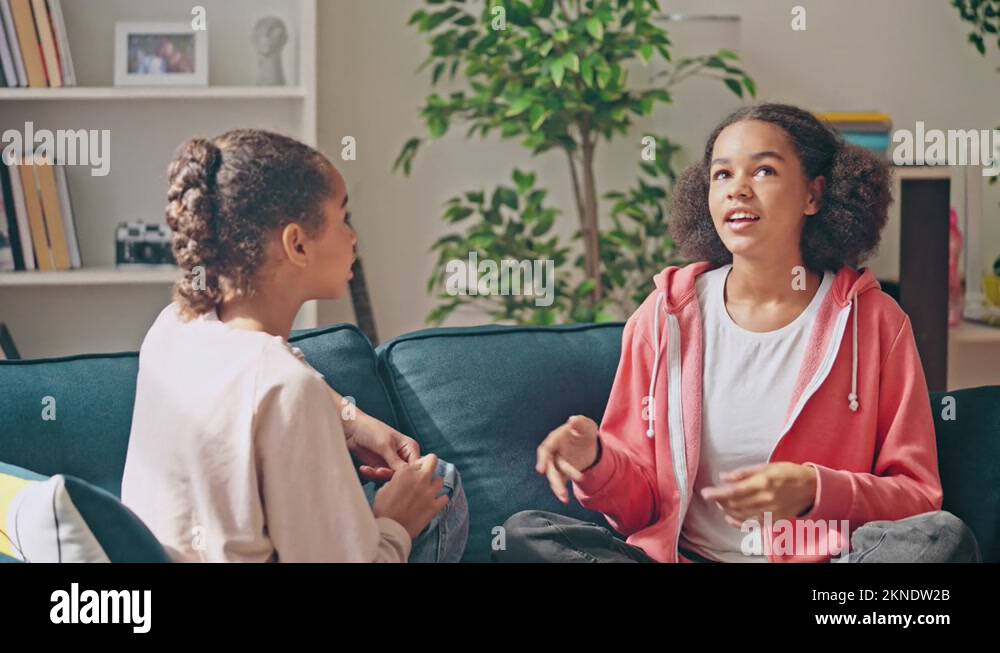 Teen sisters sitting talking together Stock Videos & Footage - HD and ...