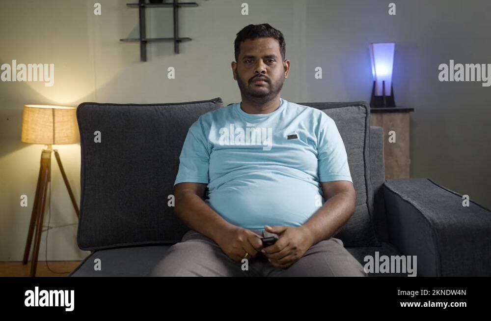 Fat man watching tv Stock Videos & Footage - HD and 4K Video Clips - Alamy
