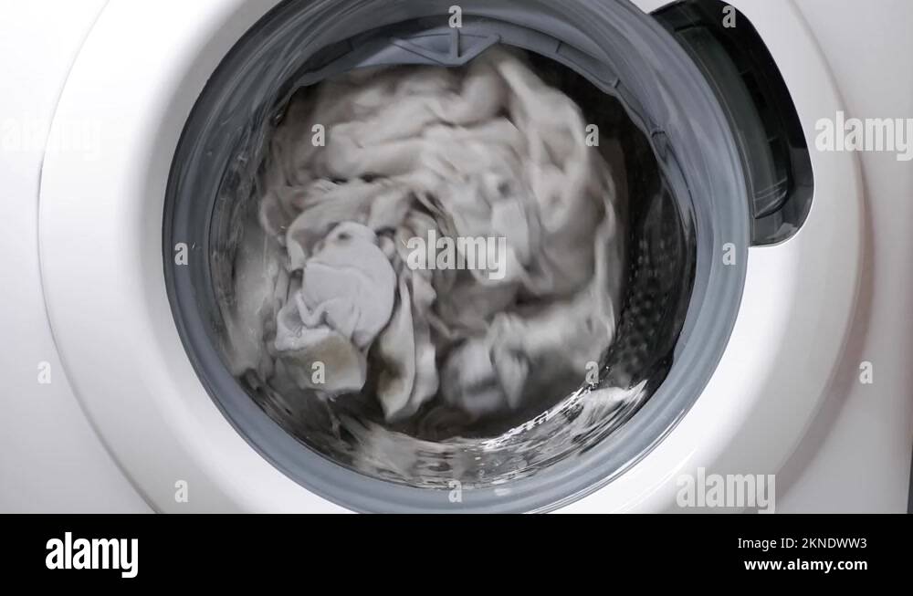 Washing clothes in a washing machine. 4k Stock Video Footage - Alamy