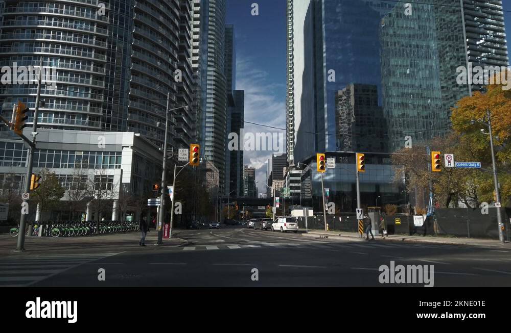 Tilt down from buildings to street traffic at Queens Quay in Toronto ...
