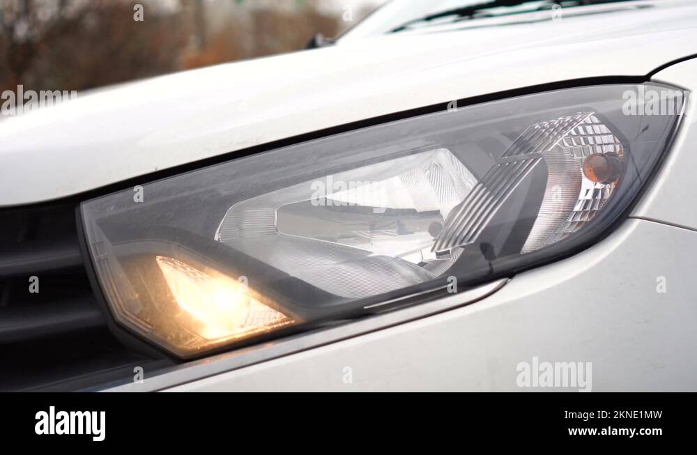 A car headlight turning on and off at day time Stock Video Footage - Alamy