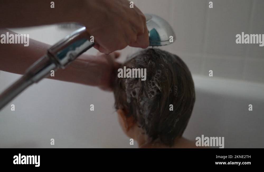 Mother showering child son head after shampoo bath Stock Video Footage ...
