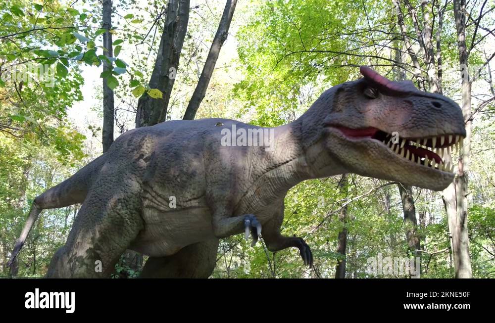 Dinosaur in the forest, at dino park. Life-size dinosaurs in the park ...