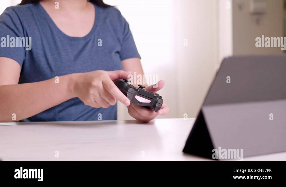 Teenager girl pressing joystick buttons in game competition, gadget ...