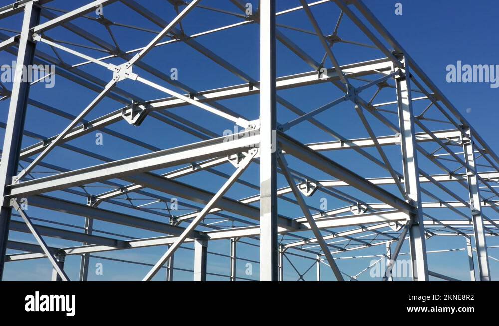Metal construction - steel frame of unfinished industrial hall ...