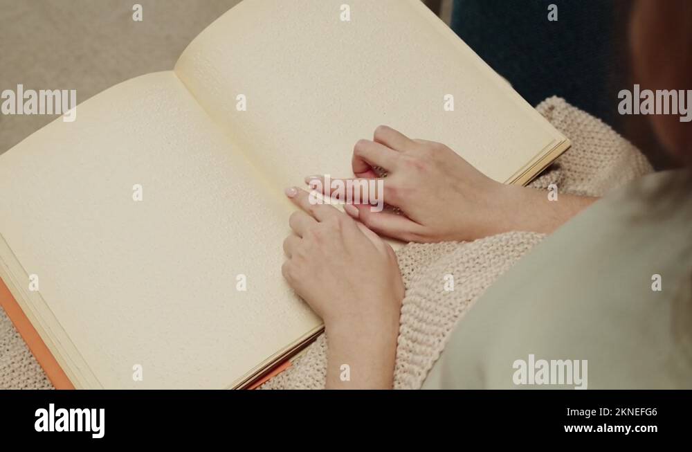 Blind woman reading braille book top view, poorly seeing female person ...